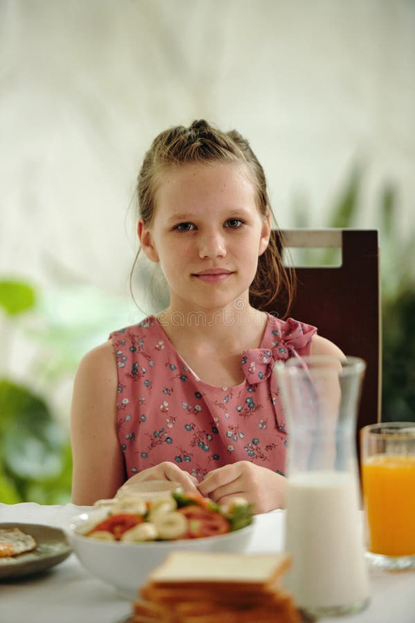 Girl Sitting at Dining Table Stock Image - Image of dinner, family ...