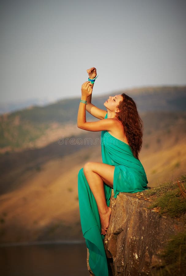 Girl Sitting on the Edge of a Cliff. Stock Image - Image of area ...