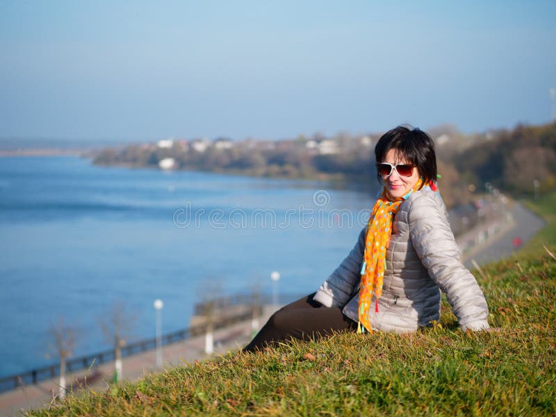 Girl Sitting on Grass in Autumn Outdoors Stock Photo - Image of adult ...