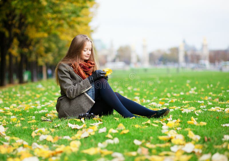 Girl Sitting on a Grass on a Fall Day Stock Photo - Image of female ...