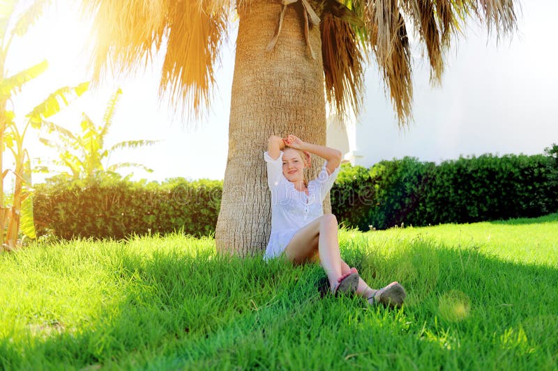 283 Girl Sitting Under Palm Tree Stock Photos - Free & Royalty-Free ...