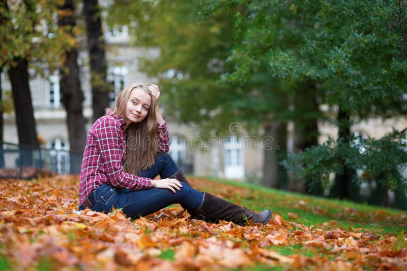 Girl Sitting on the Ground at Fall Stock Photo - Image of fall, adult ...