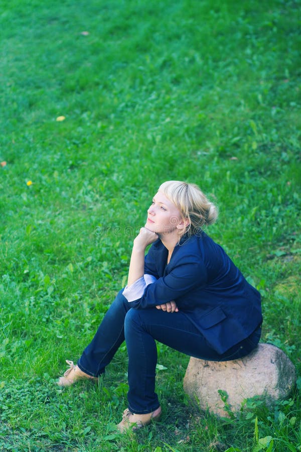 Girl sitting on a rock stock image. Image of face, rock - 27297465