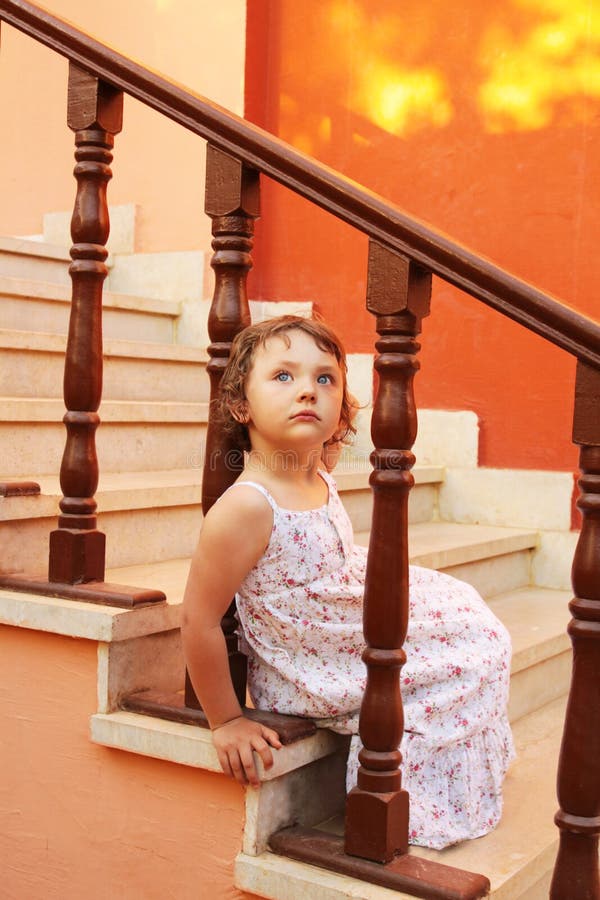 Girl sitting on the stairs stock photo. Image of pretty - 17167590