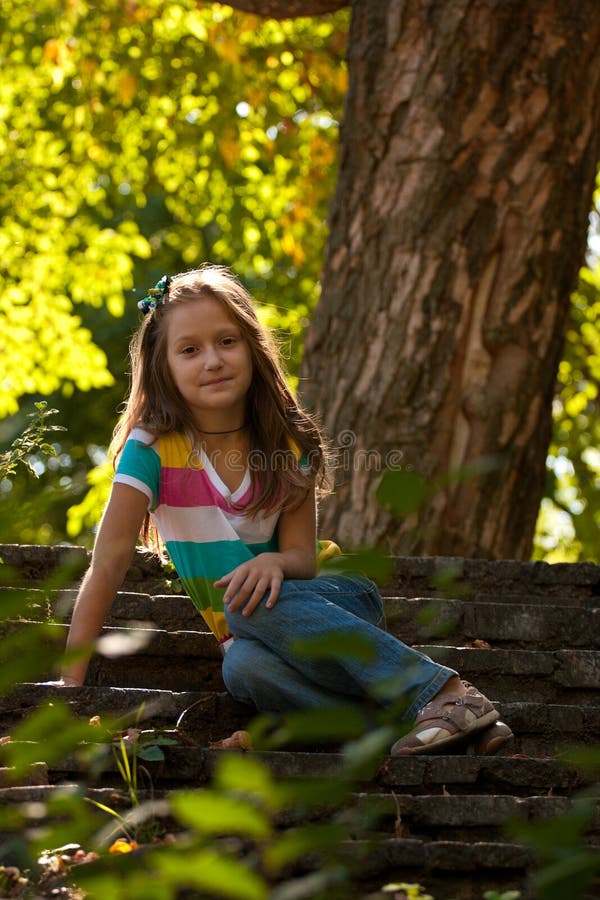 Girl sitting on a stairs stock image. Image of summer - 21964021