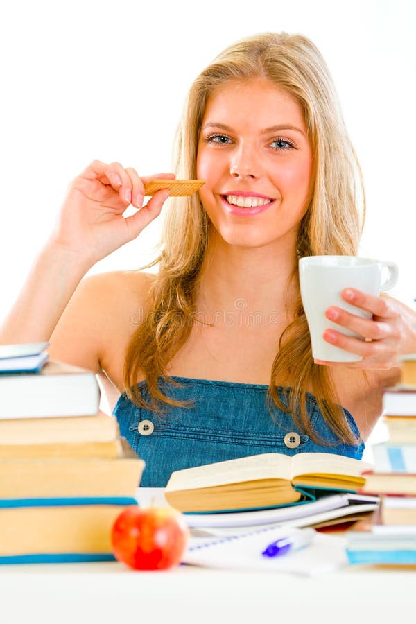 Girl Sitting at Table with Books and Drinking Tea Stock Image - Image ...
