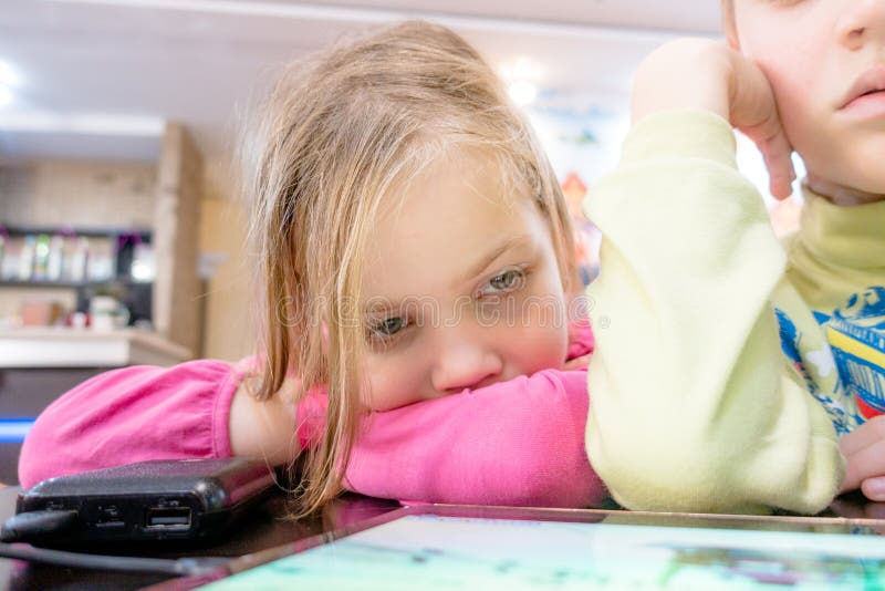 Girl Sitting at the Table Listening Attentively Stock Image - Image of ...