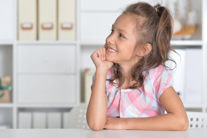 Girl sitting at table stock photo. Image of dress, daughter - 101161524