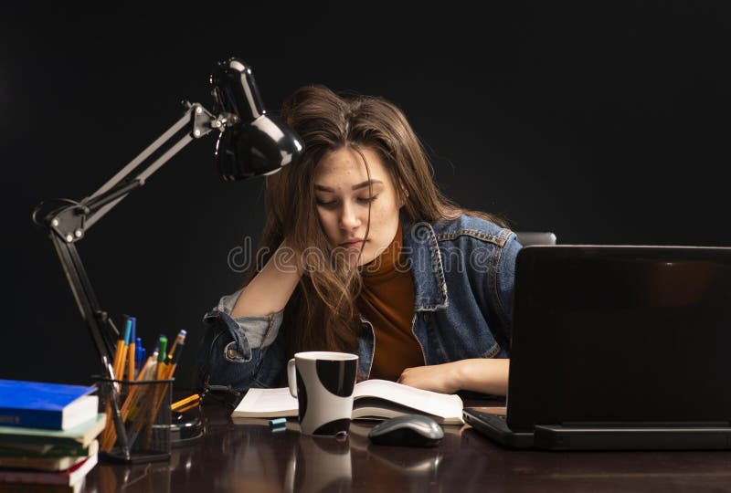The Girl is Sitting at the Table and Study Stock Image - Image of ...