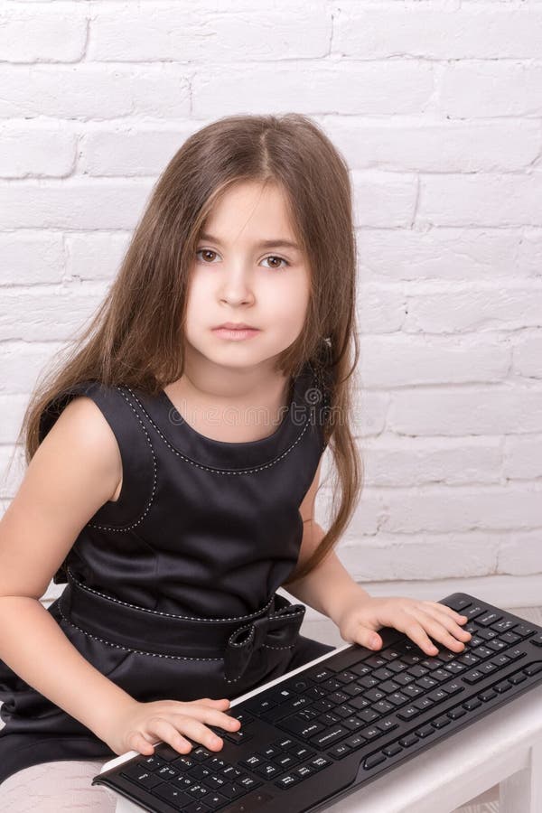 Girl Sitting and Working at the Keyboard Stock Image - Image of ...