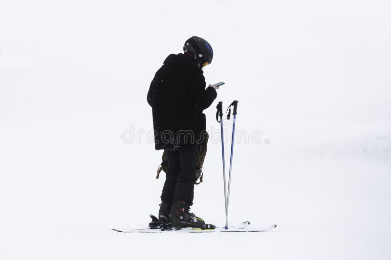 Girl in a Ski Suit Stands on a Snowy Slope Stock Photo - Image of snow ...