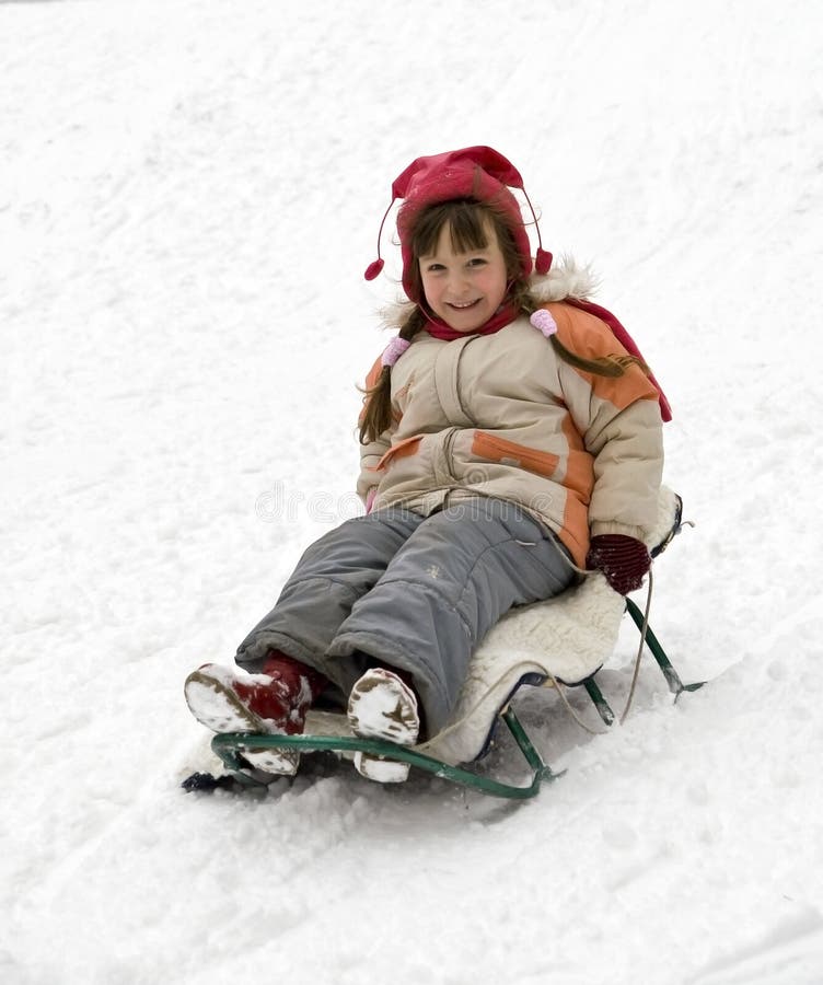 Girl sledding down a hill stock image. Image of sled - 42977865