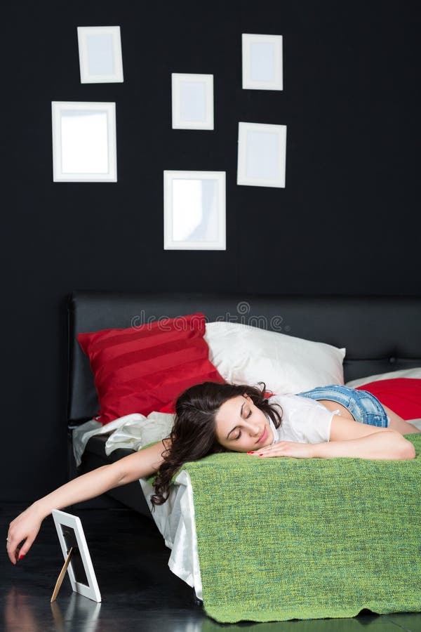 The Girl is Sleeping on a Bed in a Room with Empty Stock Image - Image ...