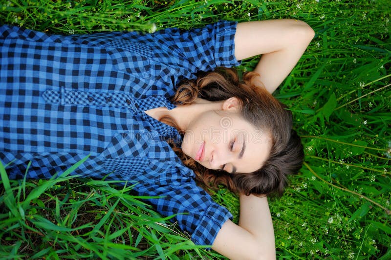 Girl sleeping in grass stock image. Image of grass, head - 10465541