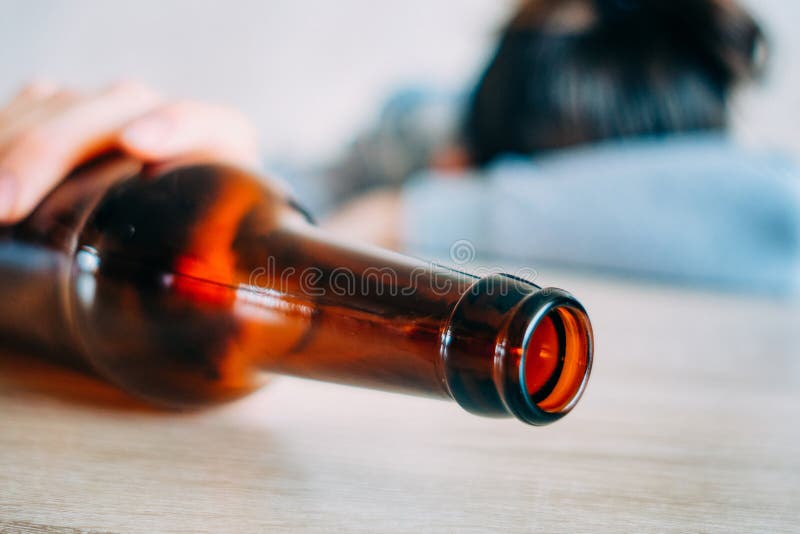 Girl Sleeping on a Table with a Bottle of Beer Stock Image - Image of ...
