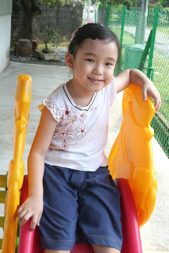 Girl on the slide stock photo. Image of young, year, girls - 1350434