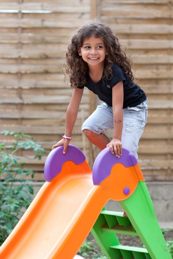 Girl and slide stock image. Image of colorful, play, hair - 20777719