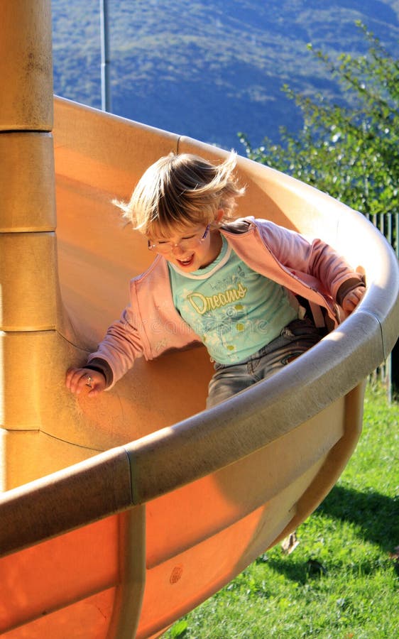Girl on slide stock image. Image of slip, friends, happy - 8494155