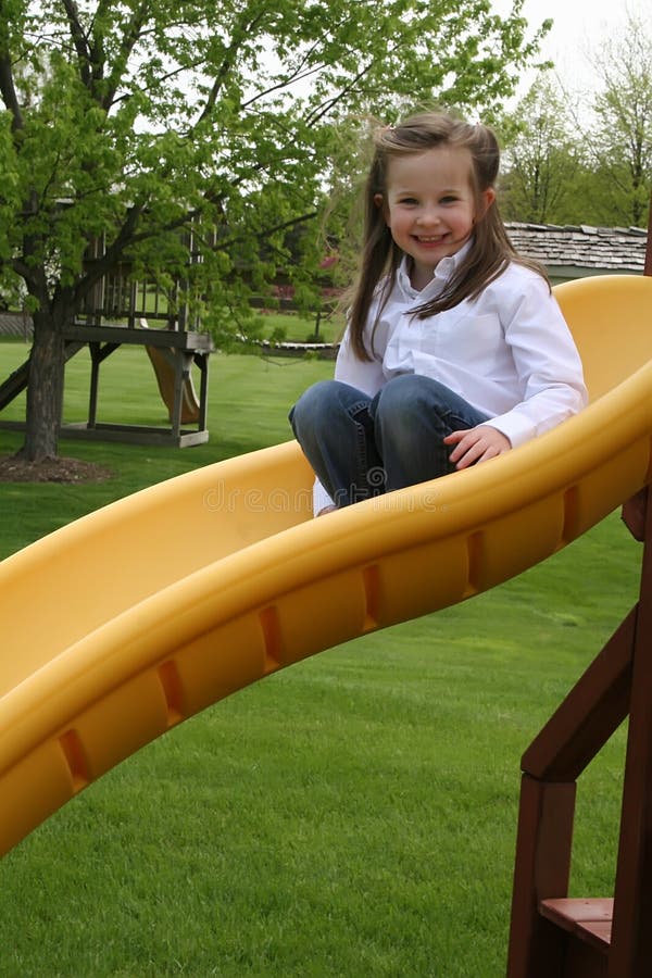 Girl on Slide stock photo. Image of young, female, slide - 8568306