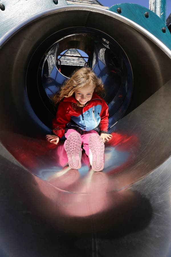 Girl in a slide stock image. Image of sliding, tunnel - 40869543