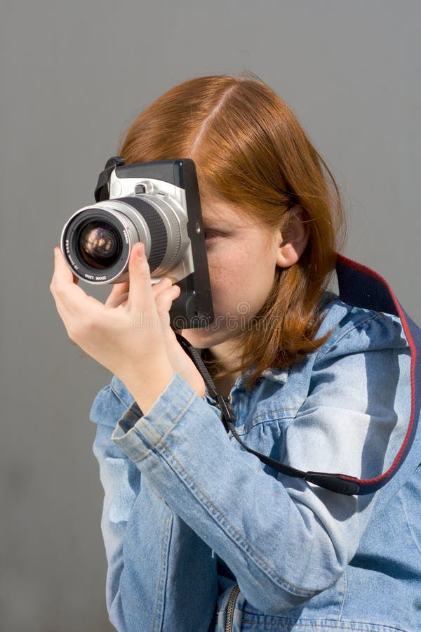 Girl with SLR photo camera stock image. Image of photographer - 1705445