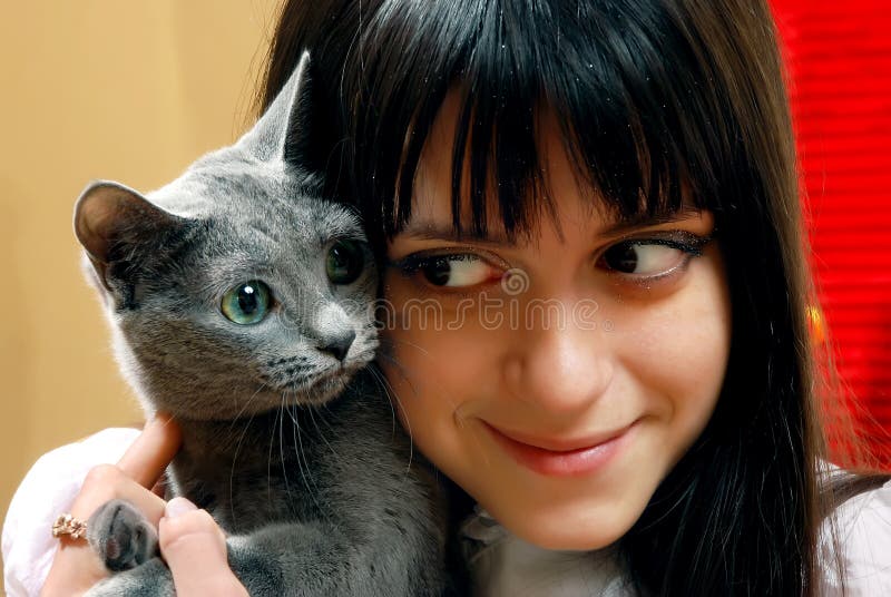 Girl with a small cat stock photo. Image of black, animal - 7561452
