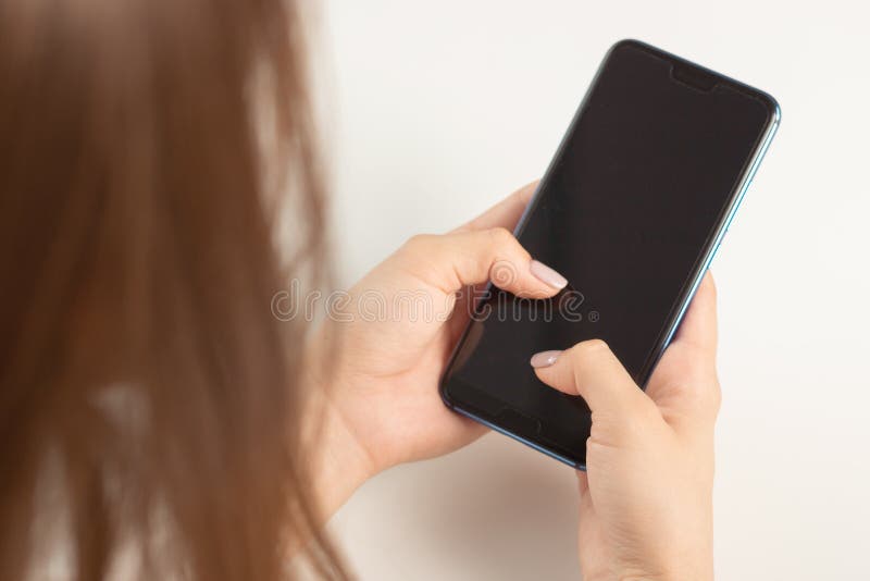 Girl with a Smartphone Typing Text on the Screen Stock Photo - Image of ...