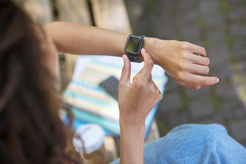 A Girl with a Smartwatch on Her Wrist Stock Photo - Image of wrist ...