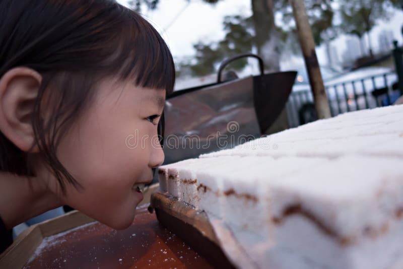 A Girl Smelling the Rice Cake. Stock Photo - Image of happy, handmade ...