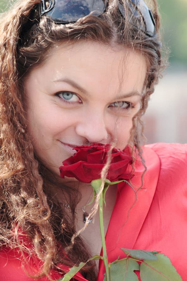 A Girl with a Smile and a Rose Stock Photo - Image of beautiful ...