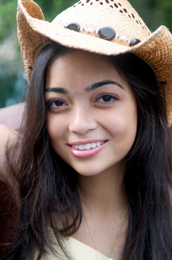 Girl smiling in Cowboy hat stock photo. Image of teenager - 20795332