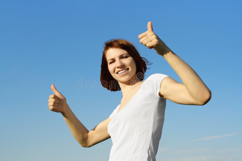 Girl Smiling and Making Thumbs Up Gesture Stock Image - Image of beauty ...
