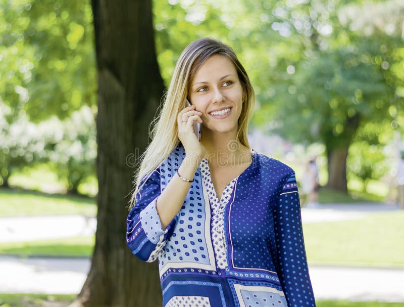 Girl smiling on the phone stock image. Image of summer - 46798073