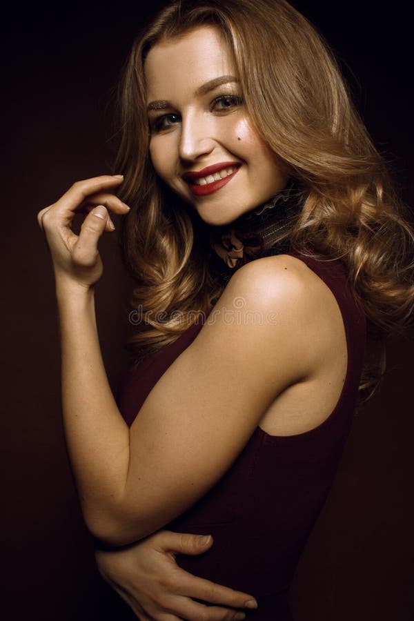 Girl Smiling on a Red Background Stock Photo - Image of studio, people ...