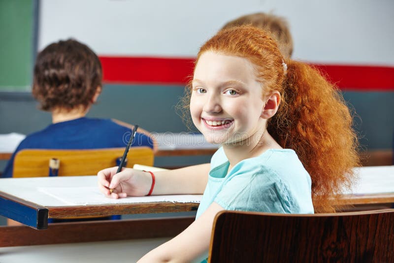 Girl Smiling in School Class Stock Photo - Image of young, write: 39039998