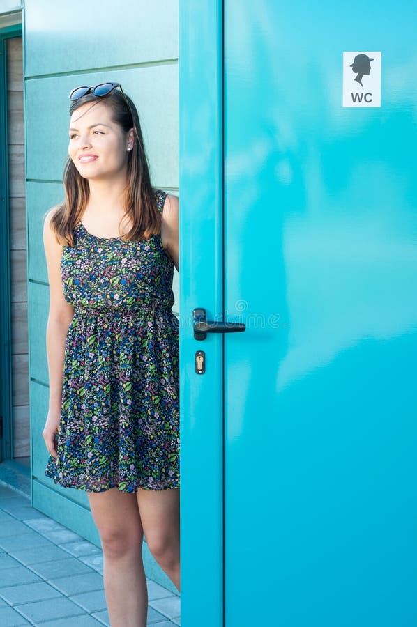 Girl Smiling and Using Public Restroom Outside Stock Image - Image of ...