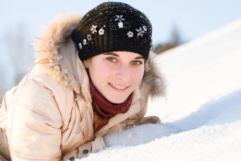 Girl in the snow stock image. Image of lying, freeze - 12372449