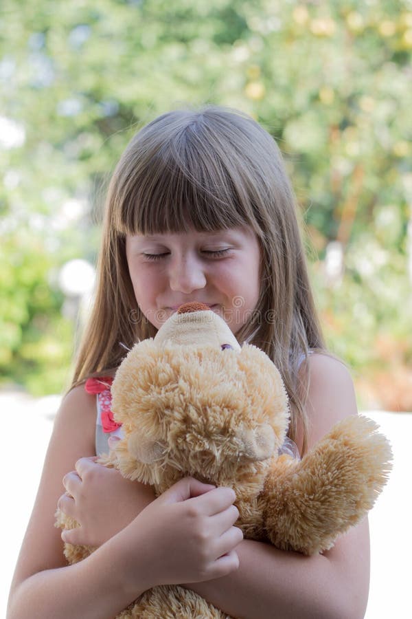Girl with a soft toy stock image. Image of little, cheerful - 43683027