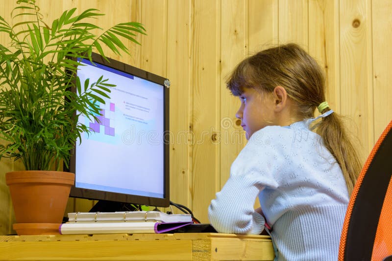 A Girl Solves a Problem on a Computer during Distance Learning Stock ...