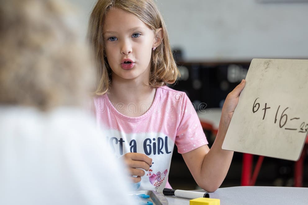 A Girl is Solving a Math Problem on a White Board Stock Image - Image ...