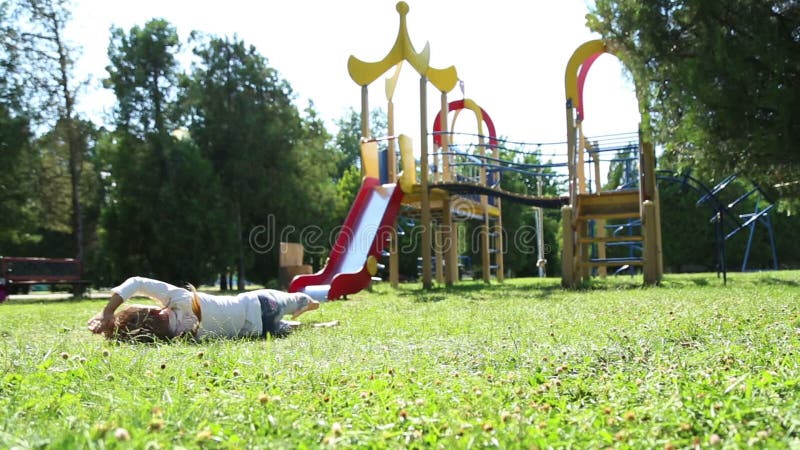 Girl Somersault on Grass Lawn Stock Footage - Video of playing, green ...