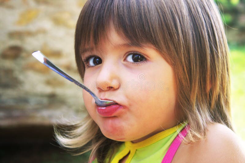 Girl with spoon stock image. Image of portrait, snack - 12277303