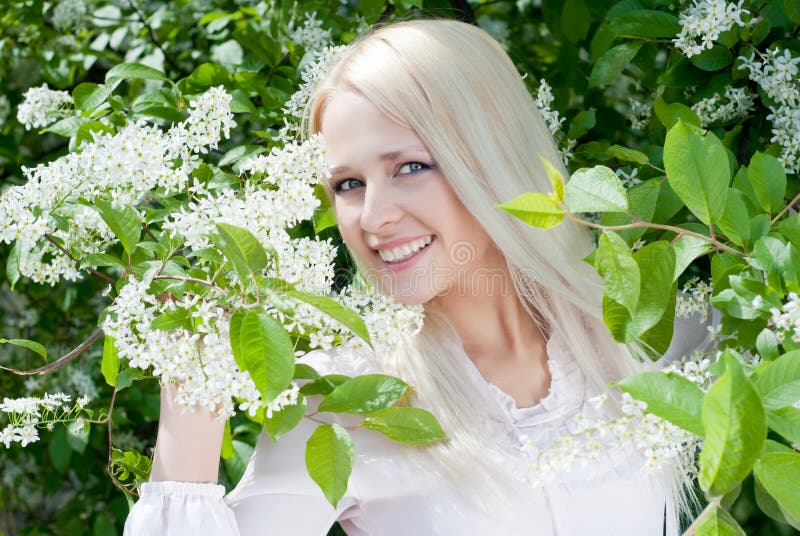 Girl in spring flowers stock photo. Image of brunette - 25029220