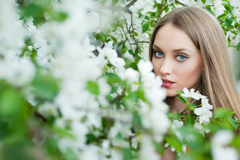 Girl in spring flowers stock photo. Image of model, face - 25130630