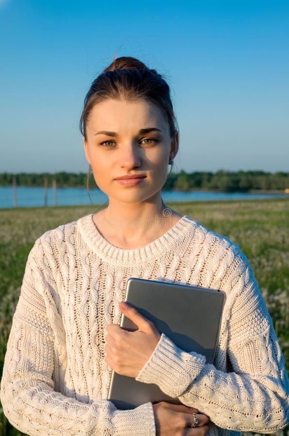 Girl Standing and Holding a Tablet Computer Stock Photo - Image of park ...