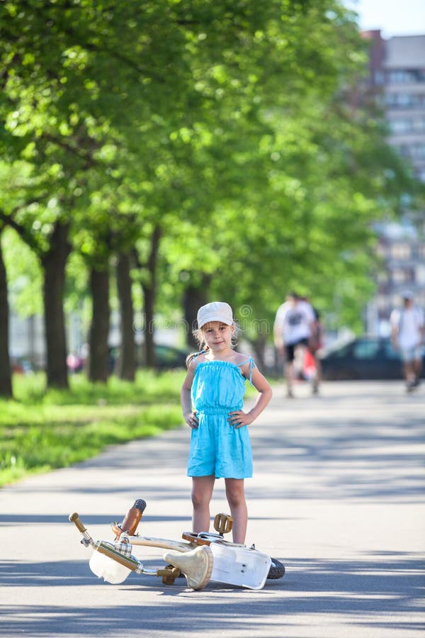 Girl Standing Near Laying Down Bicycle Stock Photos - Free & Royalty ...