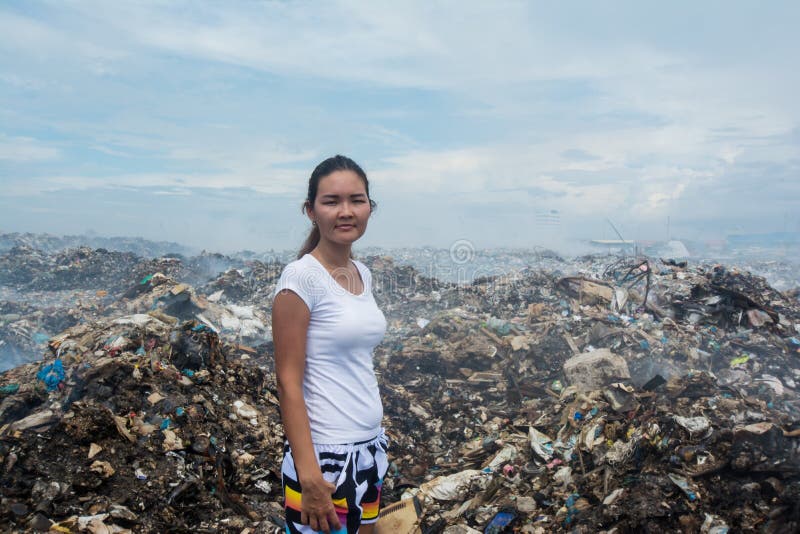 Two Girls Walking among Trash at Garbage Dump Stock Image - Image of ...