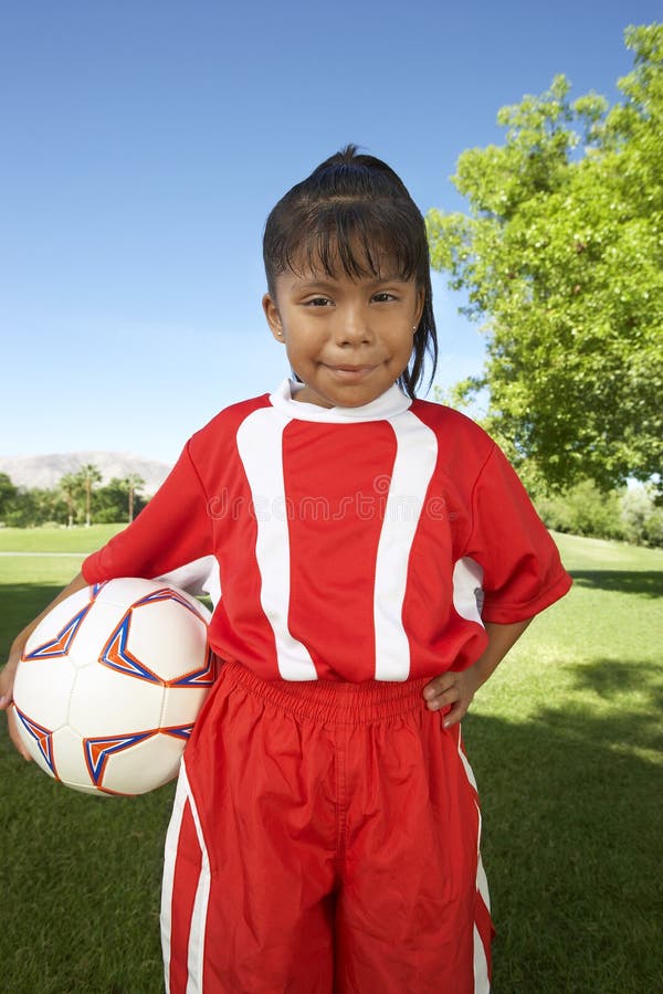 Girl Standing with Soccer Ball Stock Image - Image of field, child ...