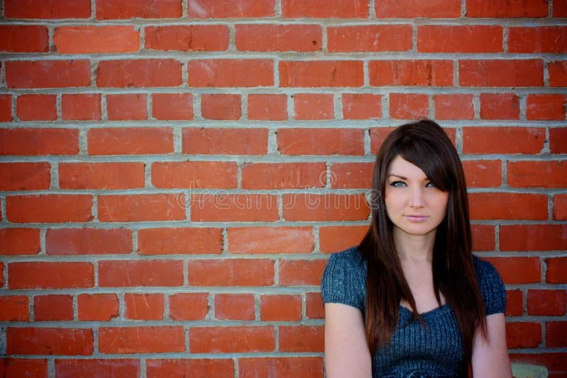 Girl standing by wall stock photo. Image of enigmatic - 9512372
