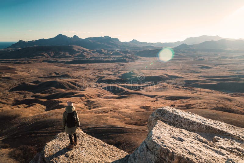 Girl Stands on the Edge of a Cliff Overlooking the Valley Stock Image ...